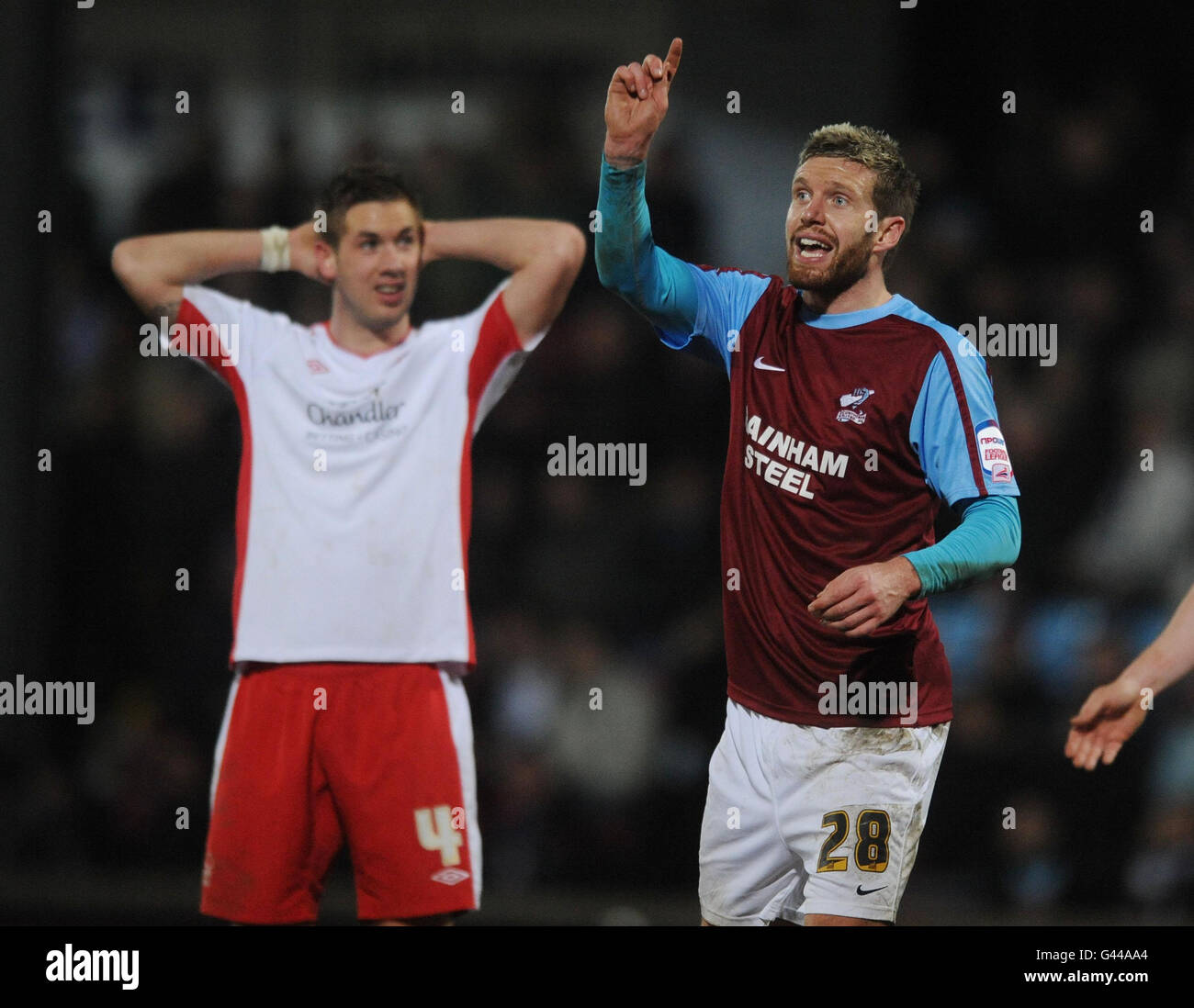 Nottingham Forest's Luke Chambers (left) and Scunthorpe United's Paul ...