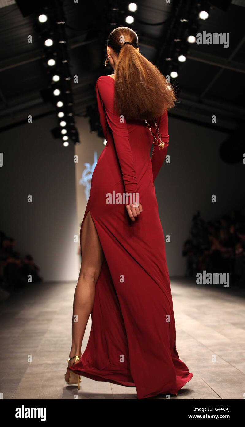 A model poses on the catwalk during the Issa show as part of London ...