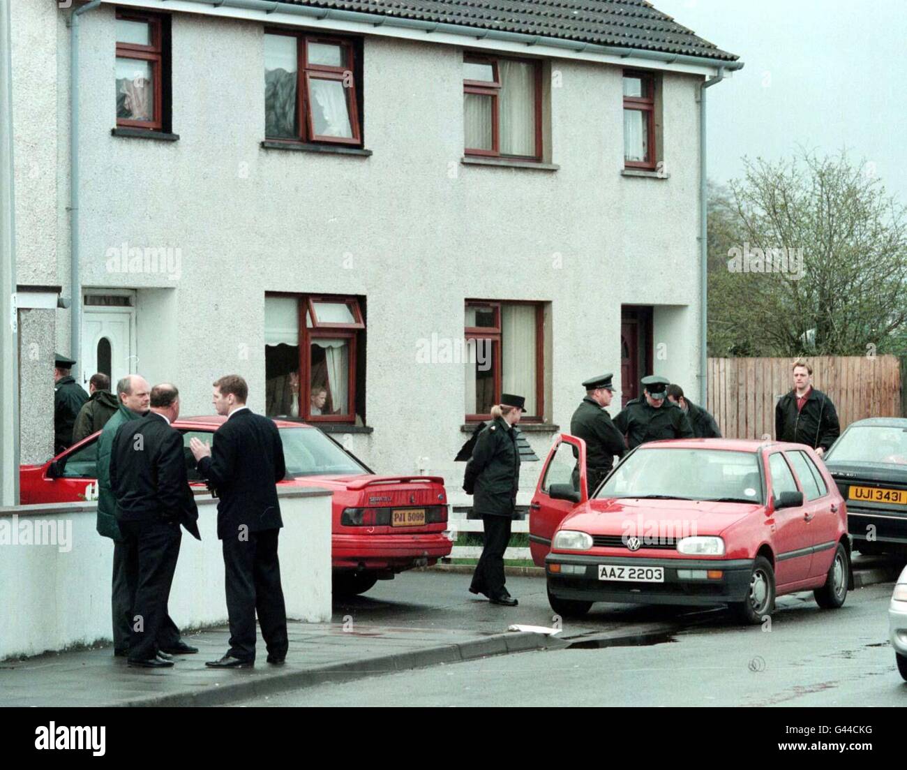RUC officers outside Kathleen Arkinson's Drumnabey Park home in ...