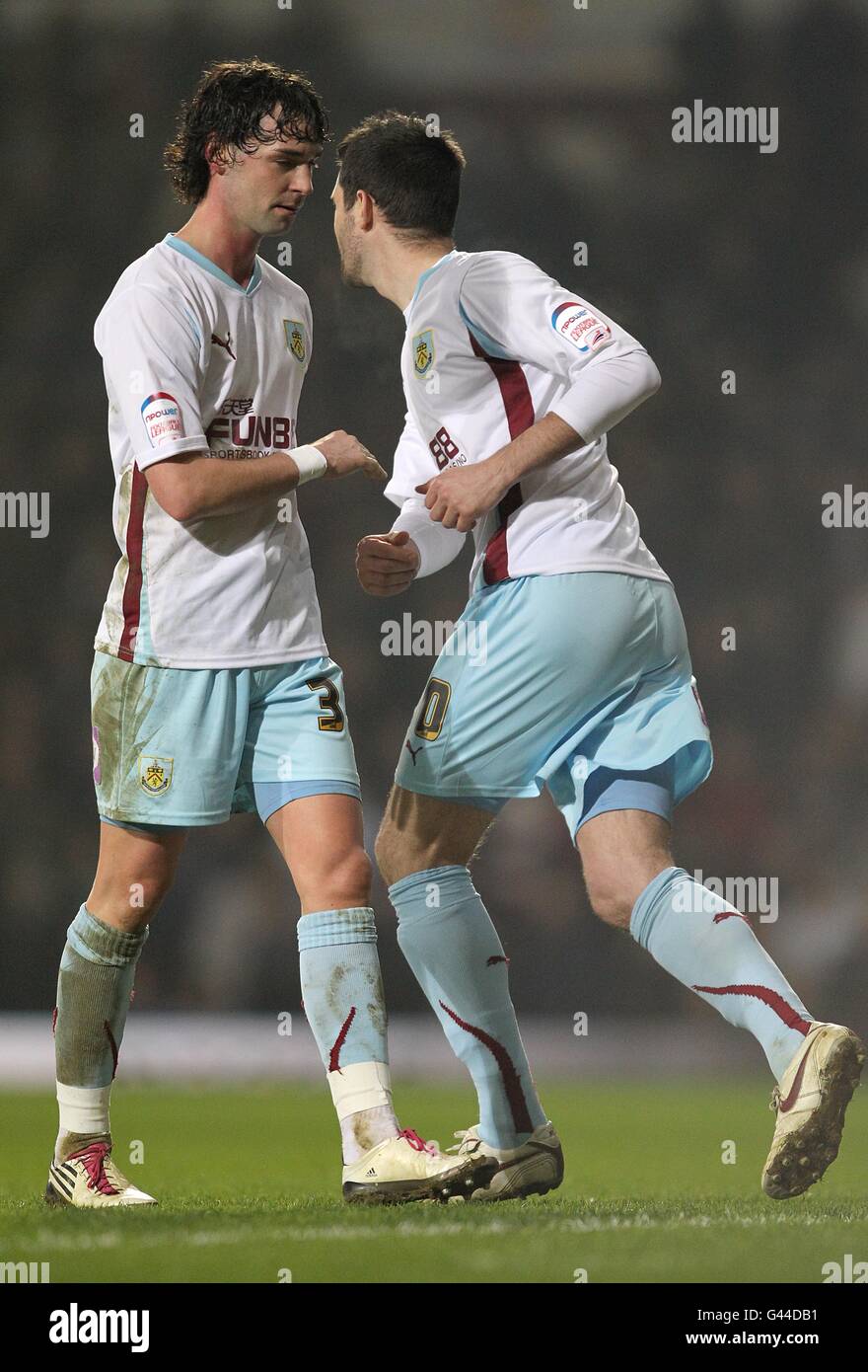 Burnley's Chris Eagles (left) is replaced by team-mate Steven Thompson ...