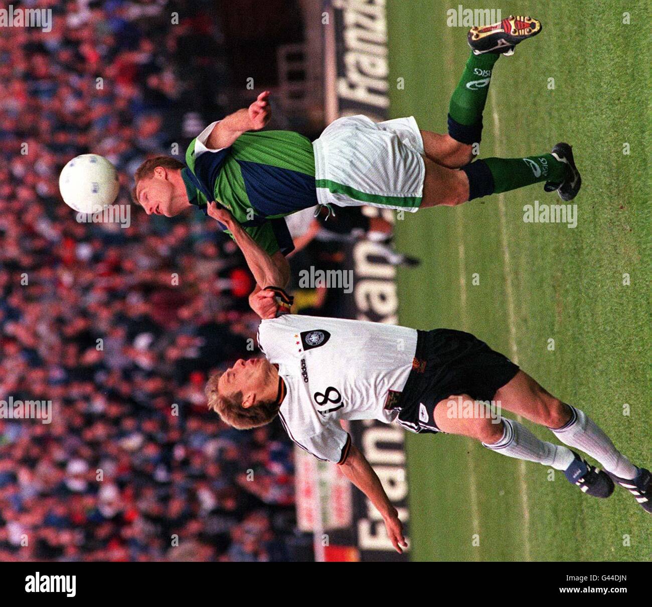 Jurgen Klinsmann of Germany (left) grapples with Colin Hill of Northern ...
