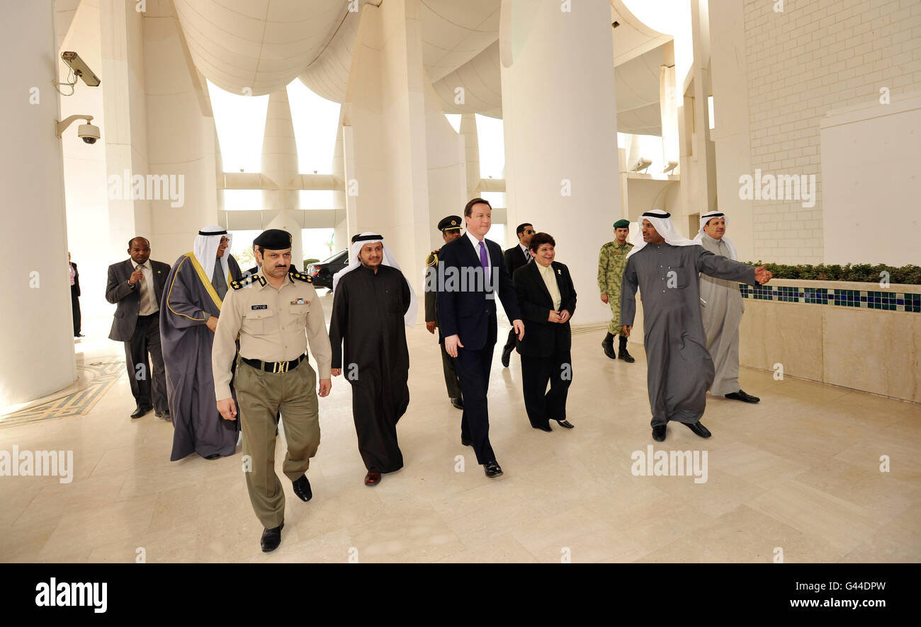 British Prime Minister David Cameron (centre) arrives at the Kuwait ...