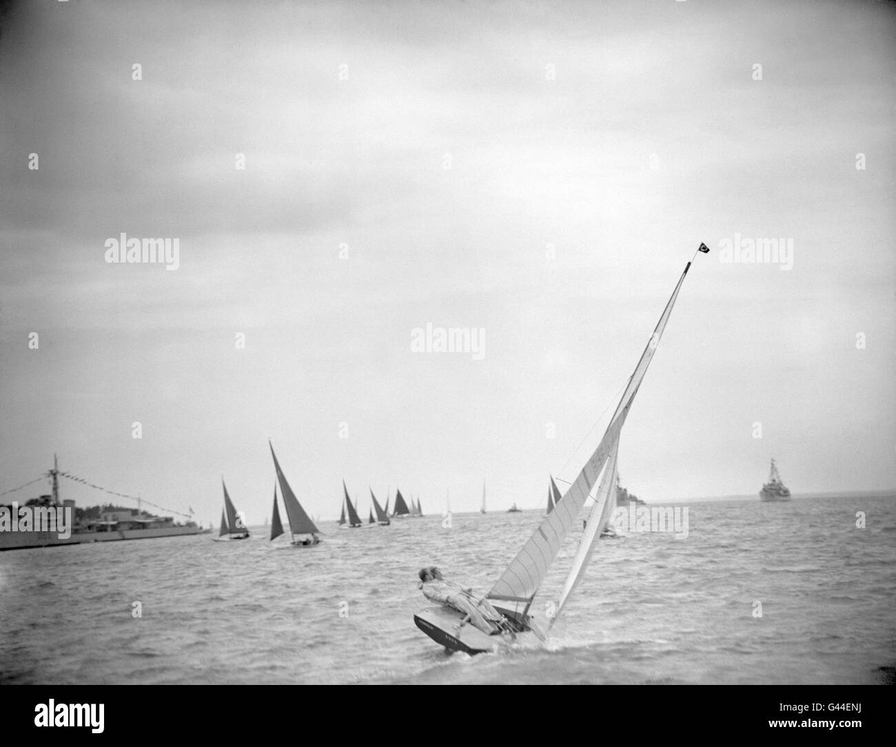 The Duke of Edinburgh, assisted by the well-known yacht designer and ...