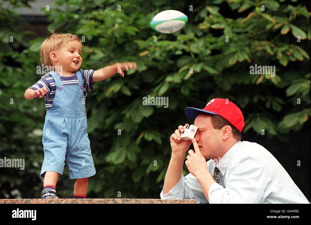 Rugby star Brian Moore with Jacob Bonnett aged 2 at the launch today ...