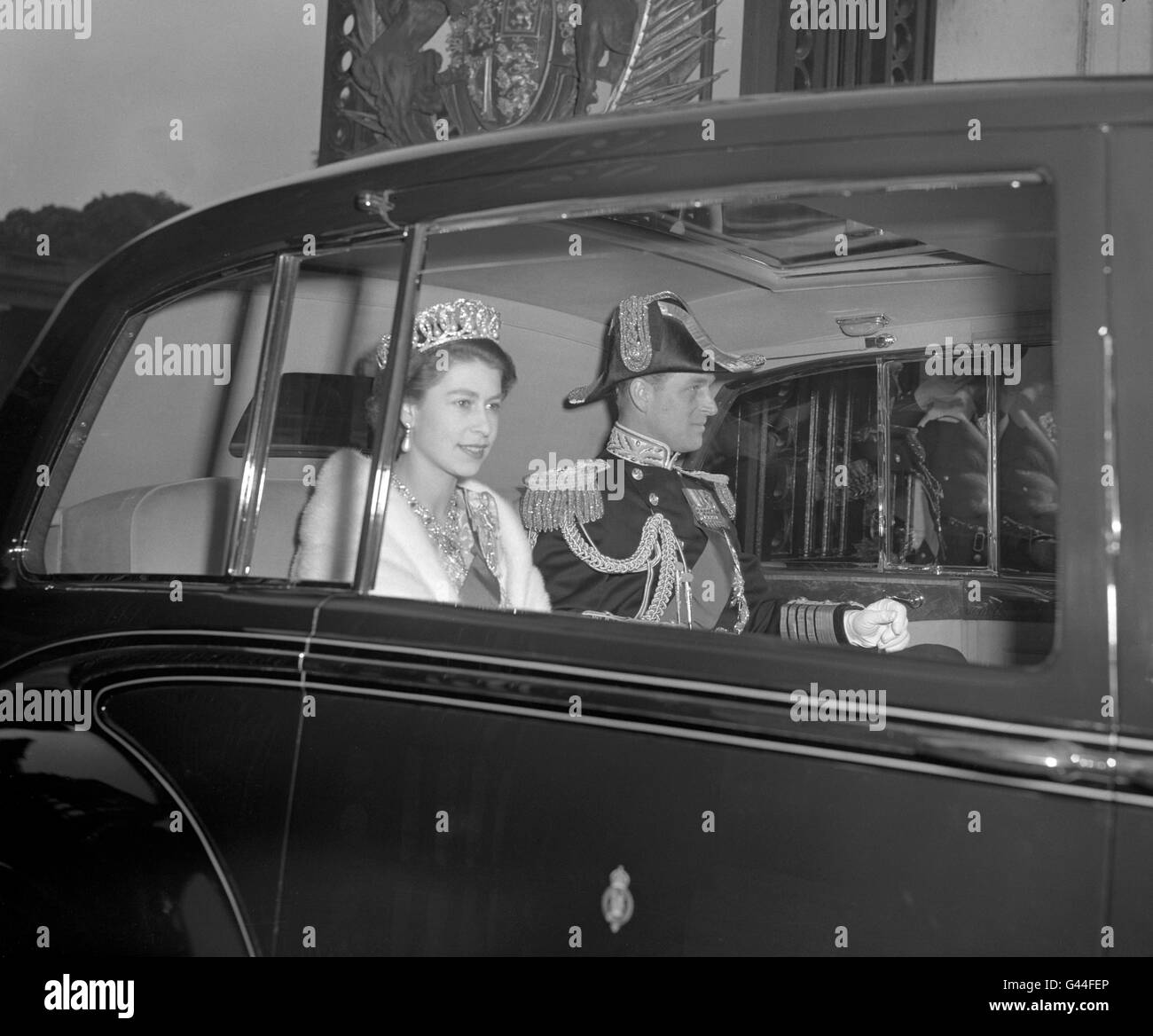 The Queen and the Duke of Edinburgh, who wears his Admiral's cocked hat ...