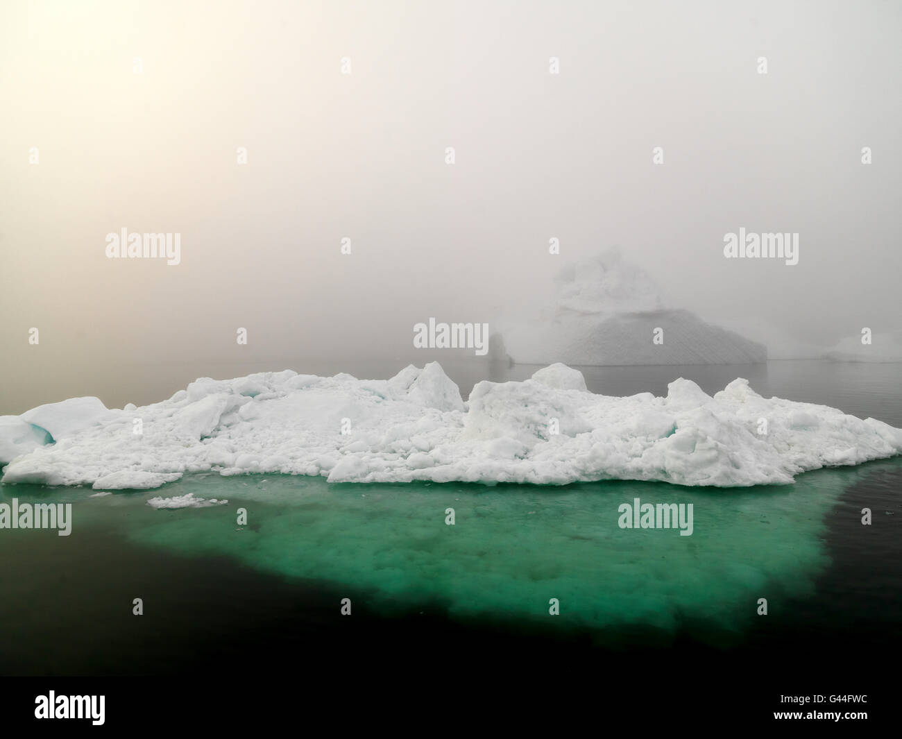 Huge icebergs are on the arctic ocean at Ilulissat ice fiord, Greenland ...