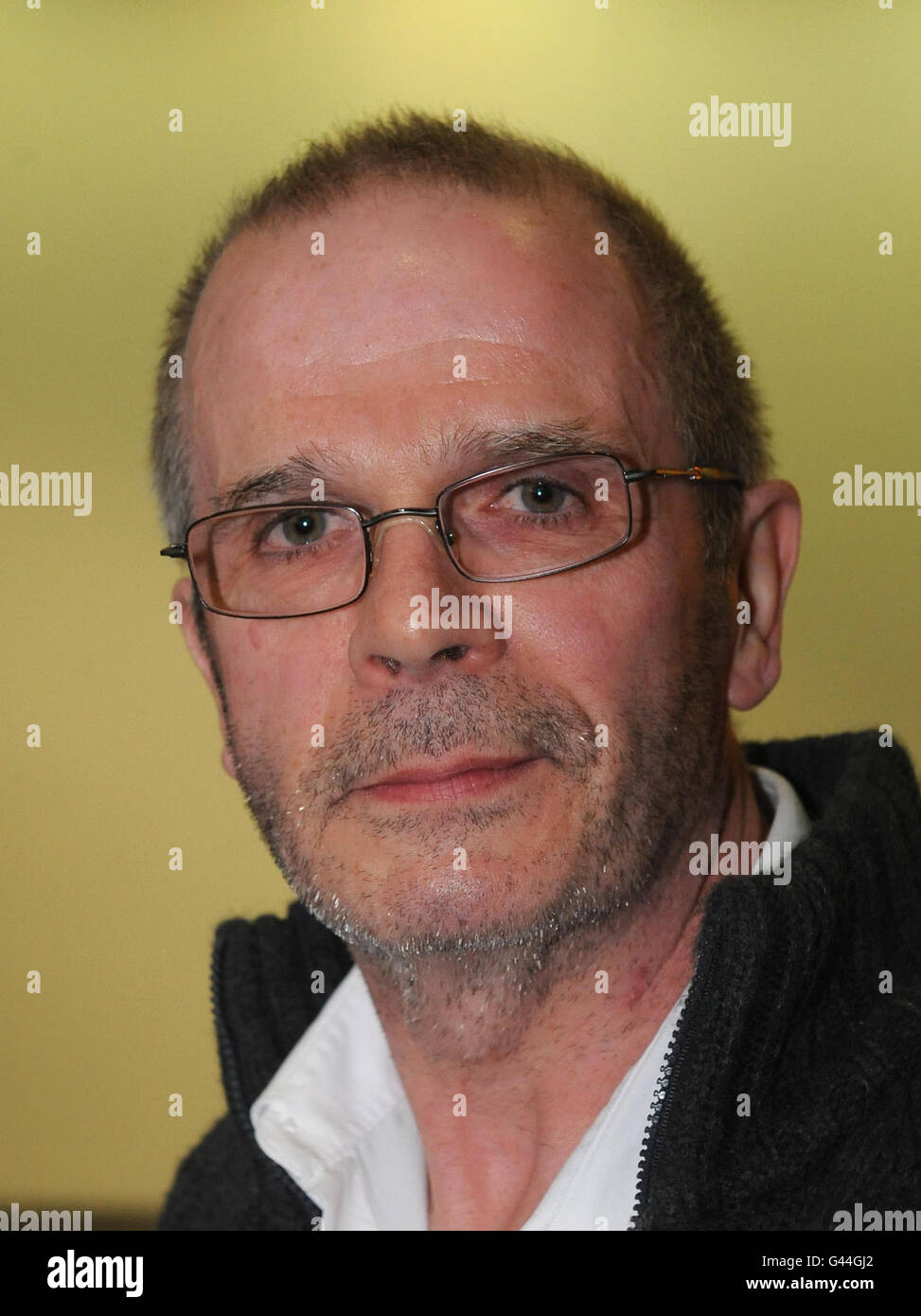 British national Alan Burnett poses for media as he arrives at Gatwick ...