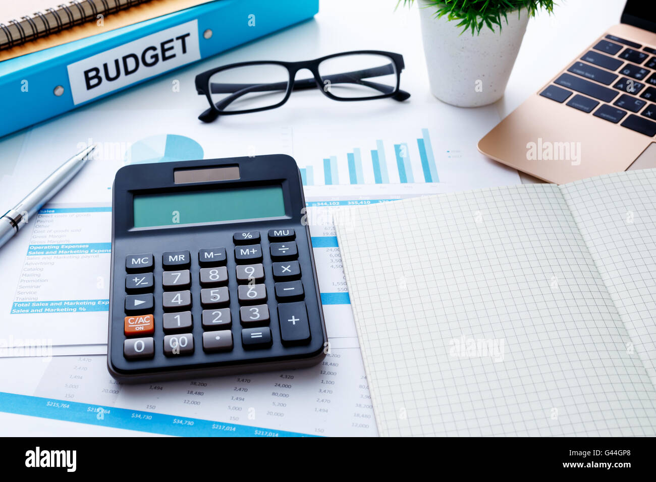 Financial and budget planning concept with calculator and notebook on ...