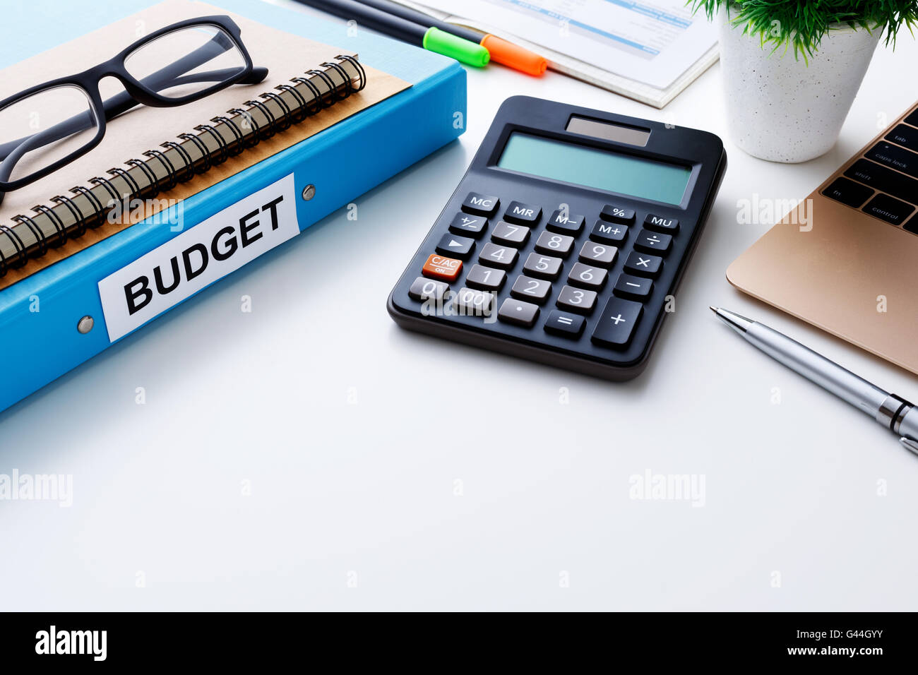 Financial and budget planning concept with calculator and laptop on ...