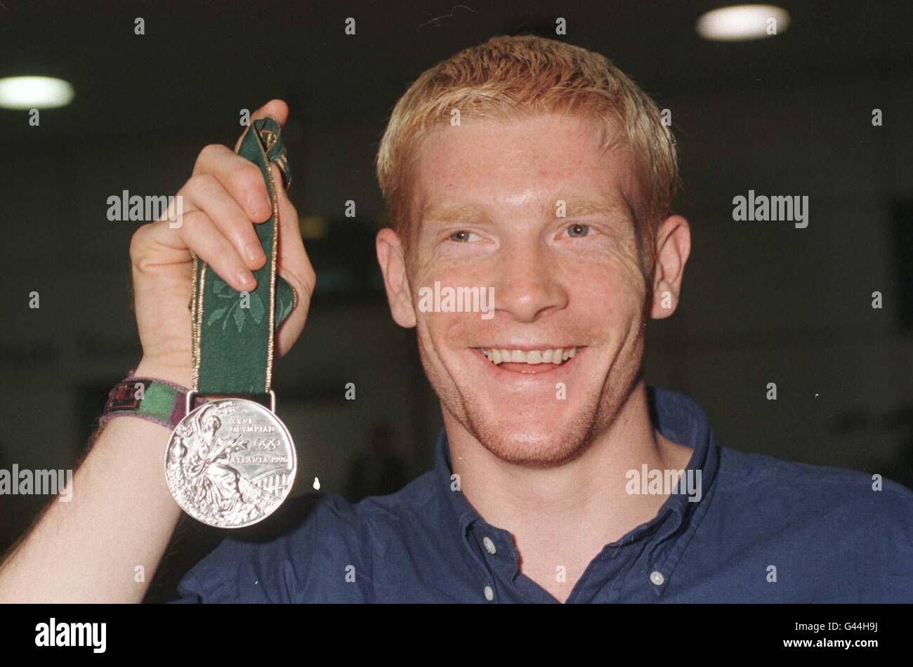 British 4X400 team member Iwan Thomas shows his Olympic silver medal ...