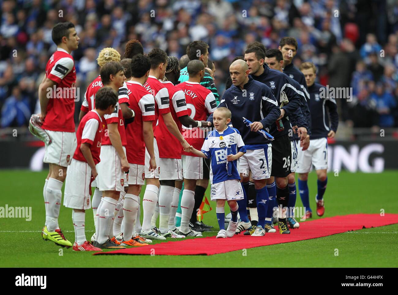 The teams shake hands before the game hi-res stock photography and ...