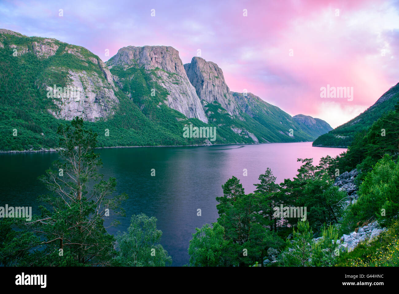 Beautiful pink sunset over Norwegian fjords Stock Photo - Alamy