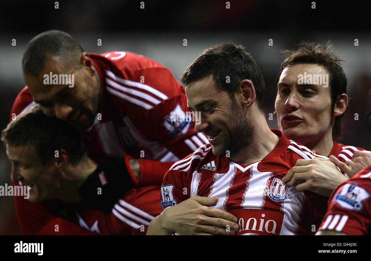 Stoke City's Rory Delap (centre right) celebrates with his team mates ...