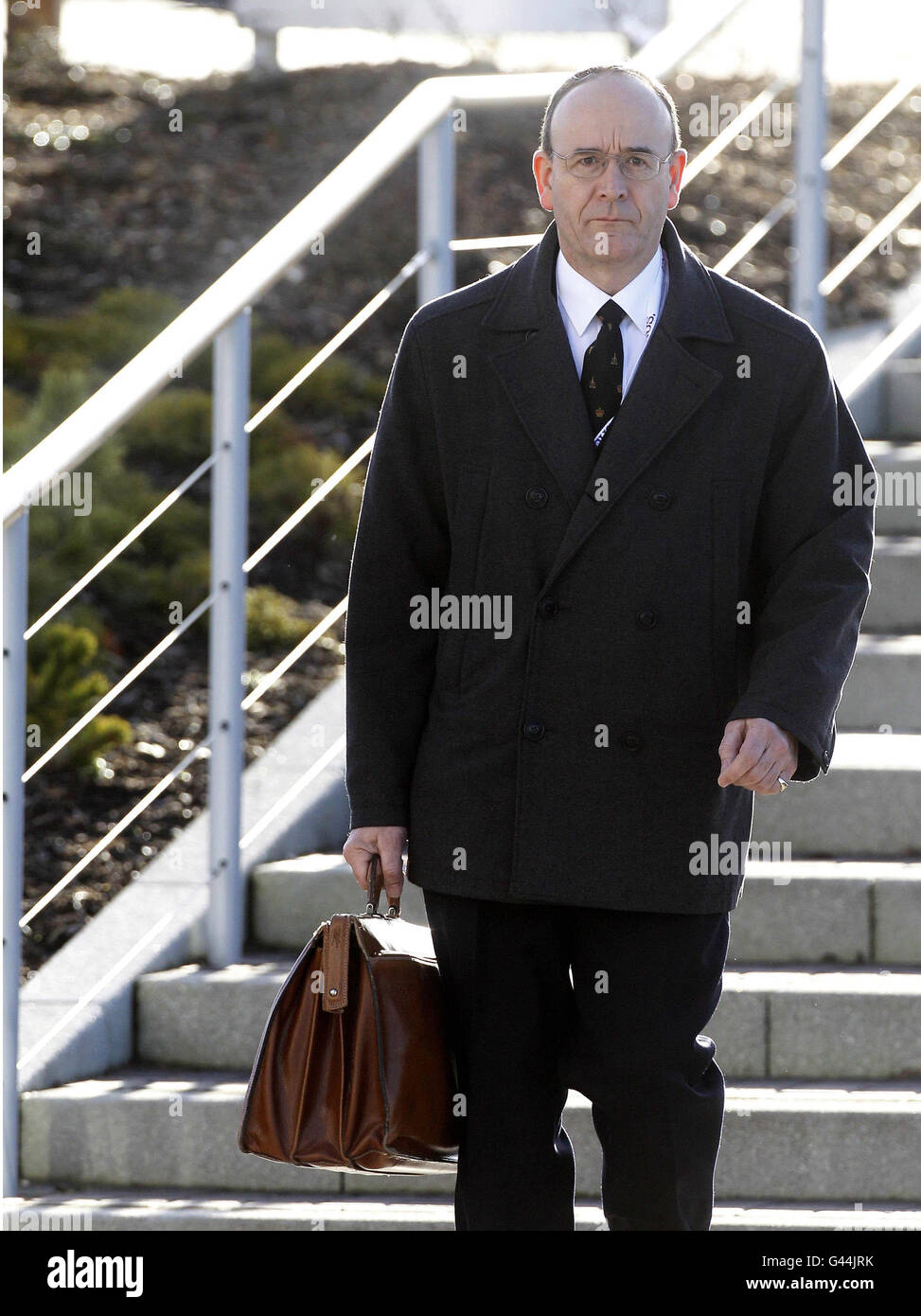 Coroner David Roberts arrives at the inquest into the death of mass ...