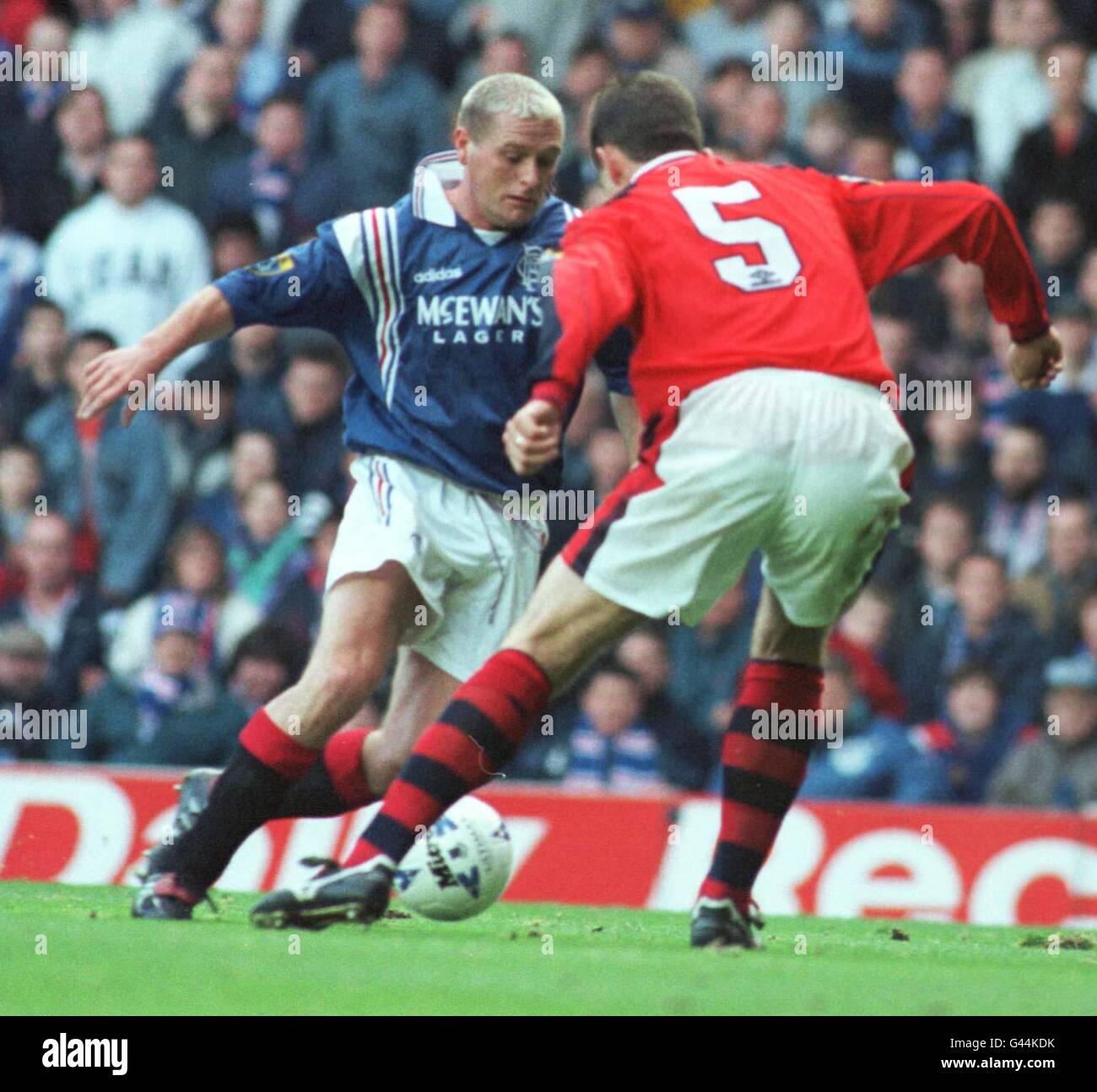Ranger's Paul Gascoigne (left) side steps Brian Irvine of Aberdeen ...