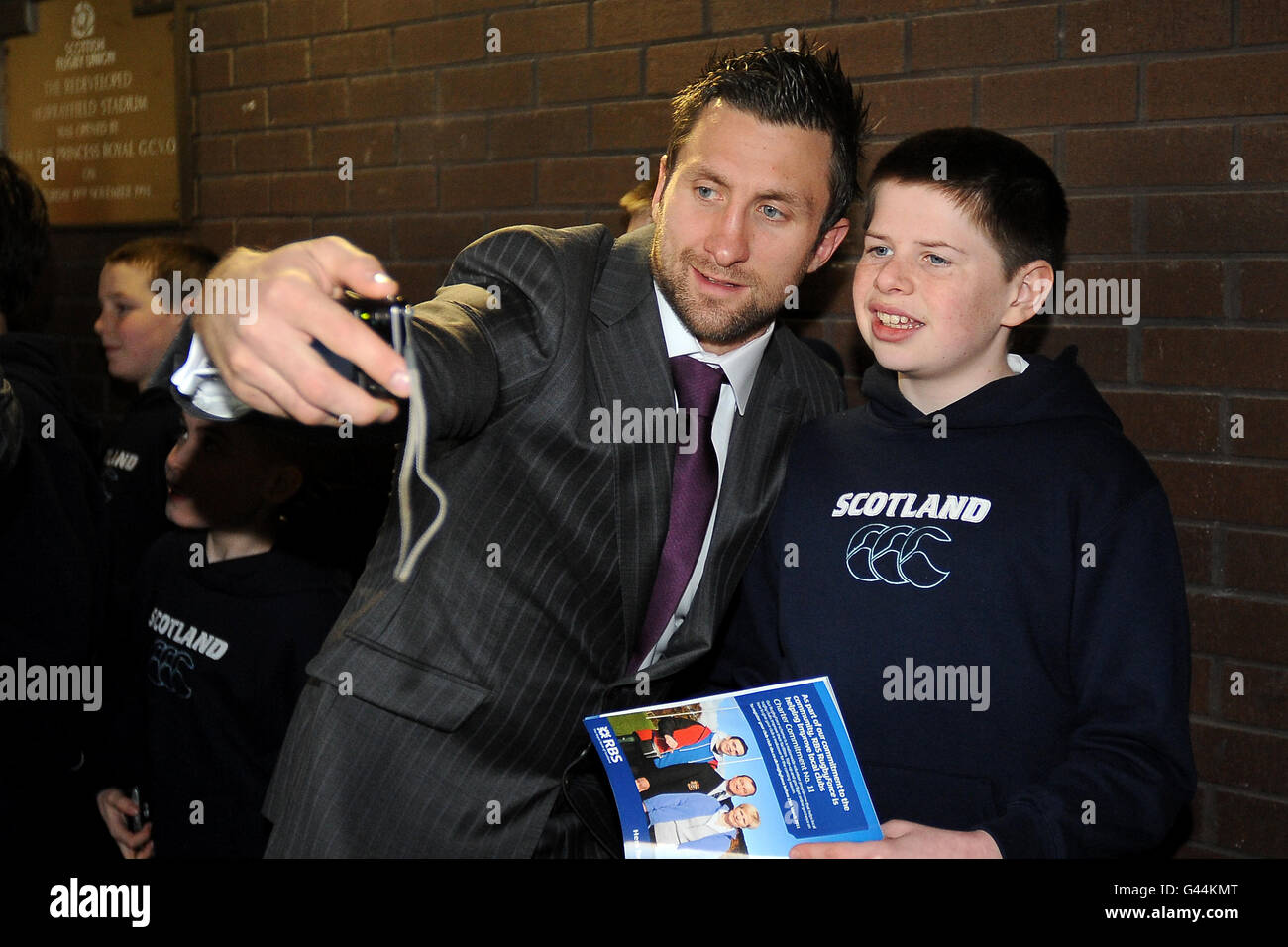 Scotland's Simon Danielli poses for a photo with the mascots after the ...