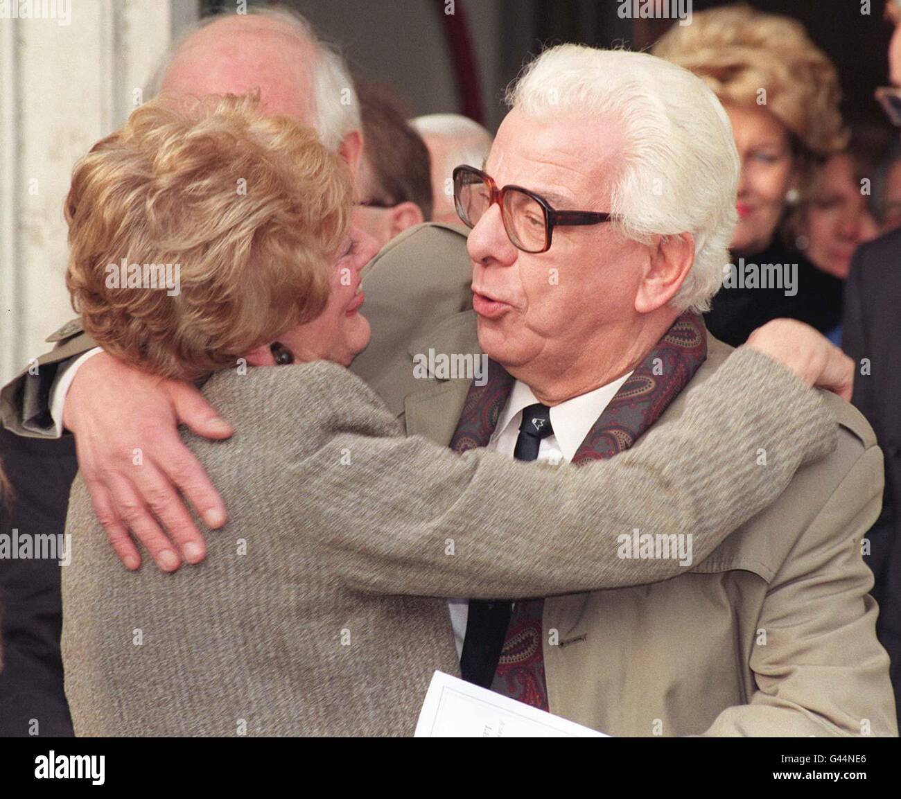 Barry Cryer hugs Jean Crowther, widow of Leslie, at a service of ...