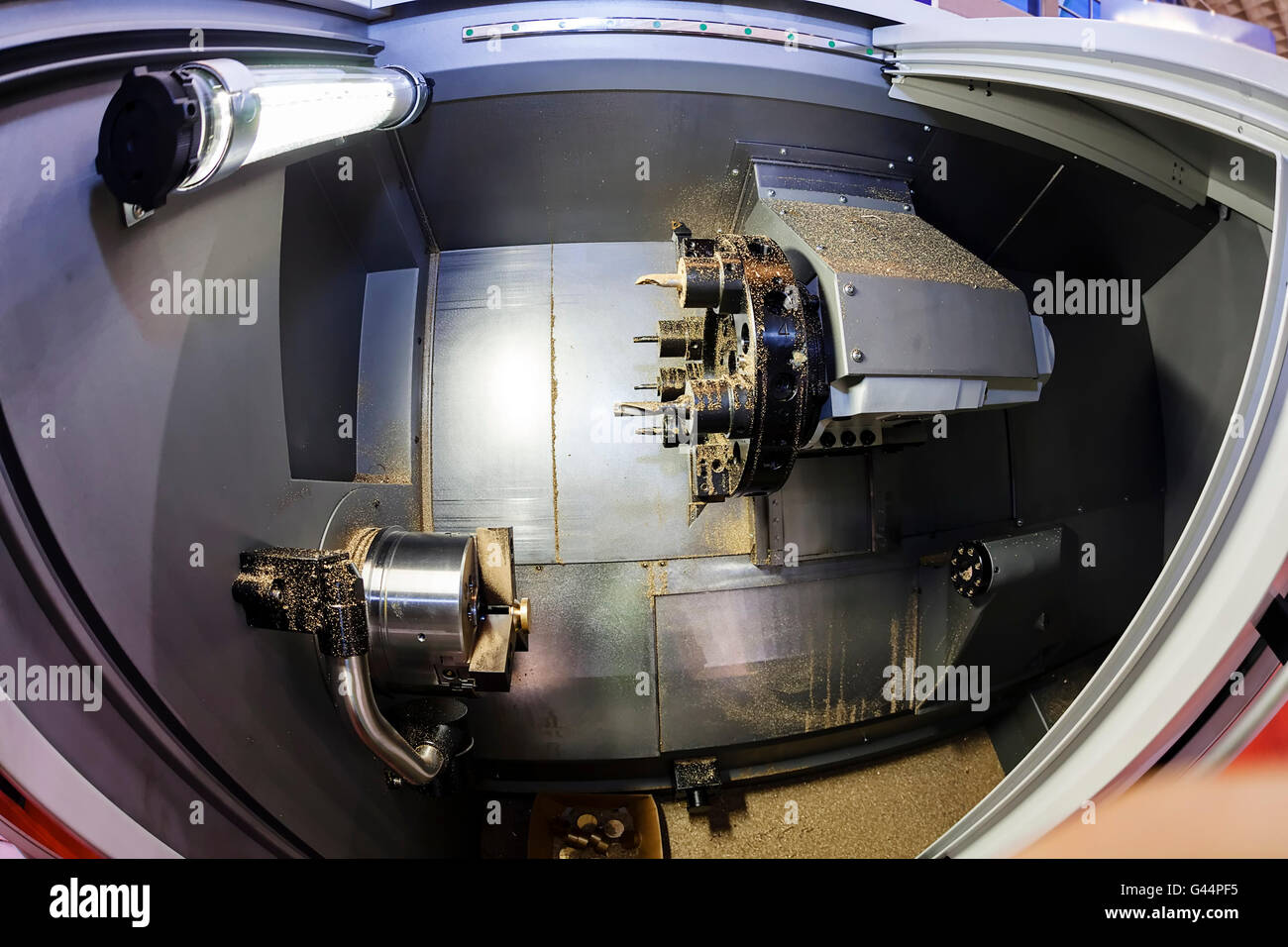 Industrial lathe tool and part of the lathe machine; note shallow depth ...