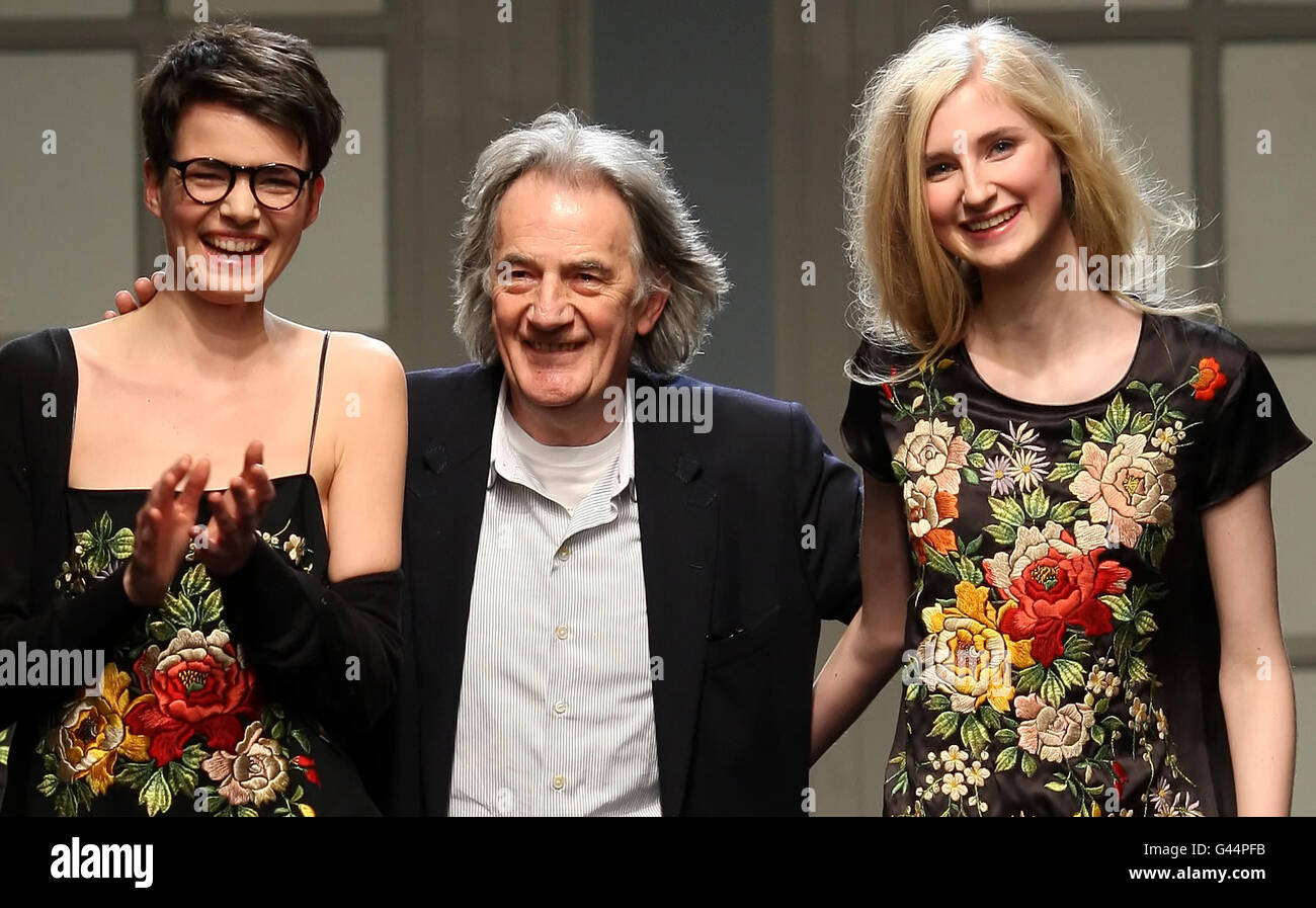 Designer Paul Smith is joined by two models following his catwalk show ...