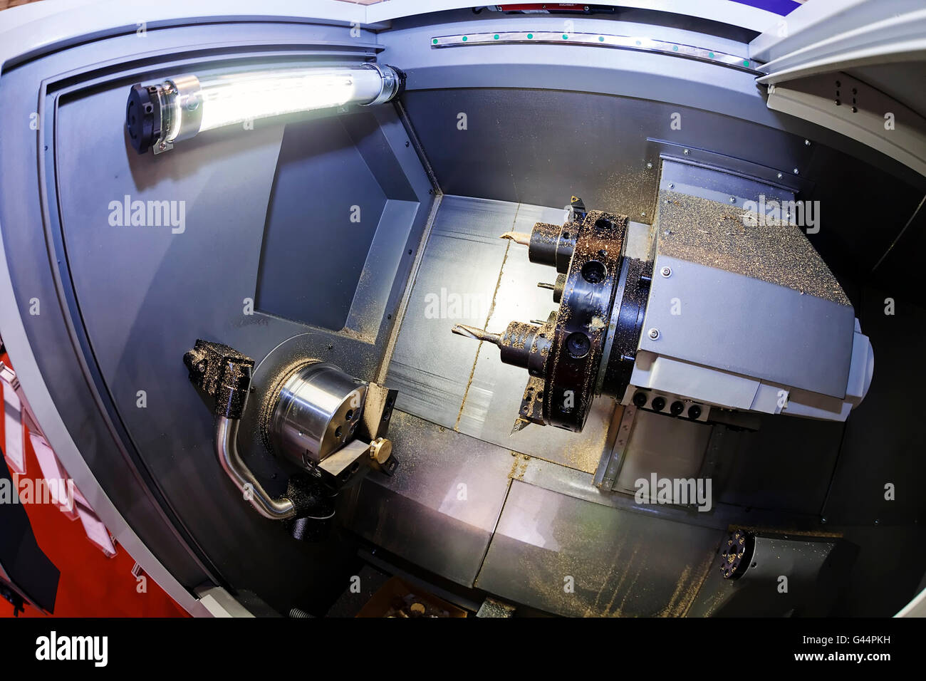 Industrial lathe tool and part of the lathe machine; note shallow depth ...