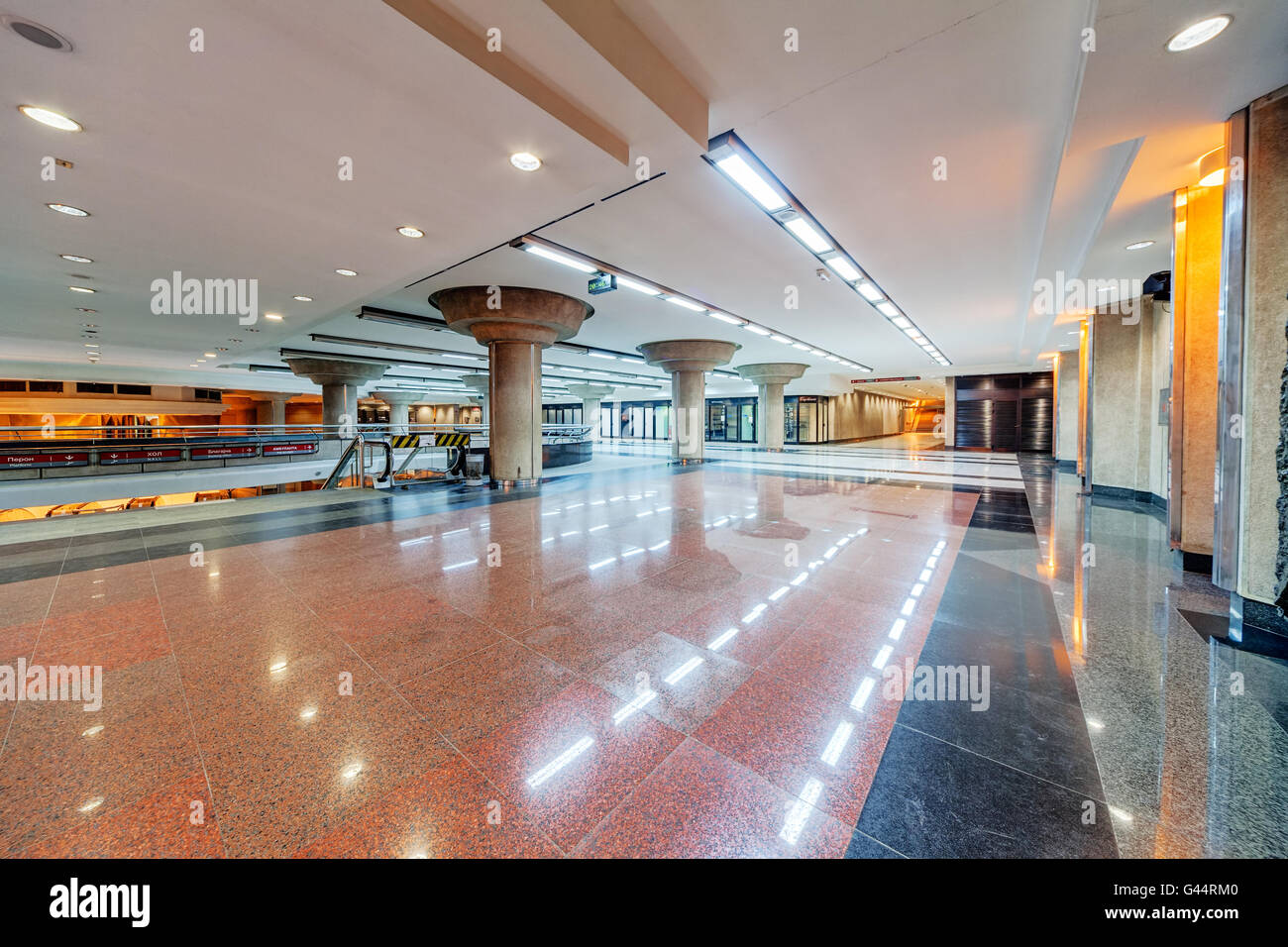 Interior of metro station with marble hall and neon lights Stock Photo ...