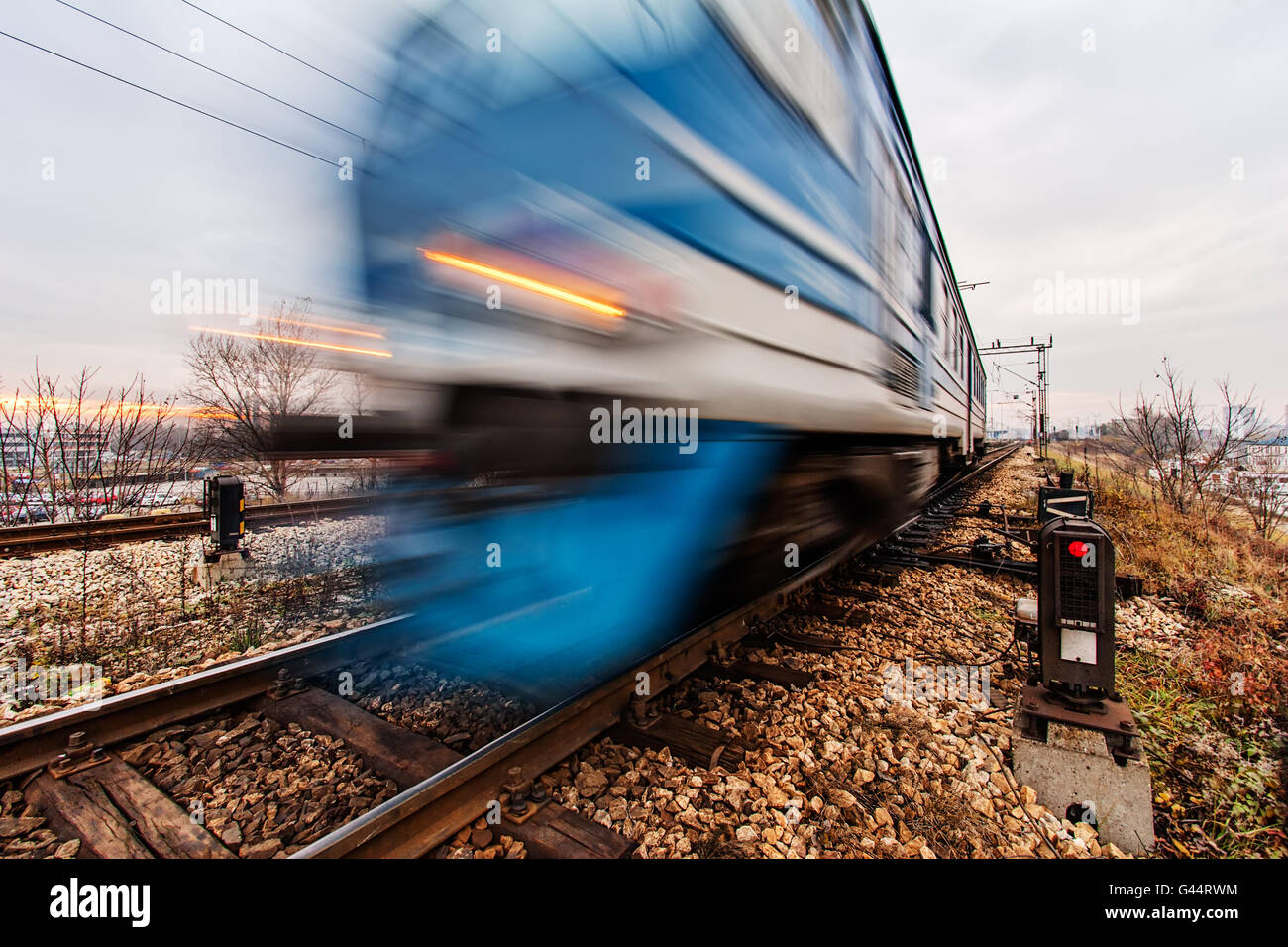 fast moving blurred train entering train station Stock Photo - Alamy