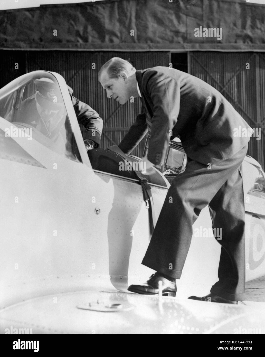 The Duke of Edinburgh inspecting the cockpit of his Chipmunk aircraft ...