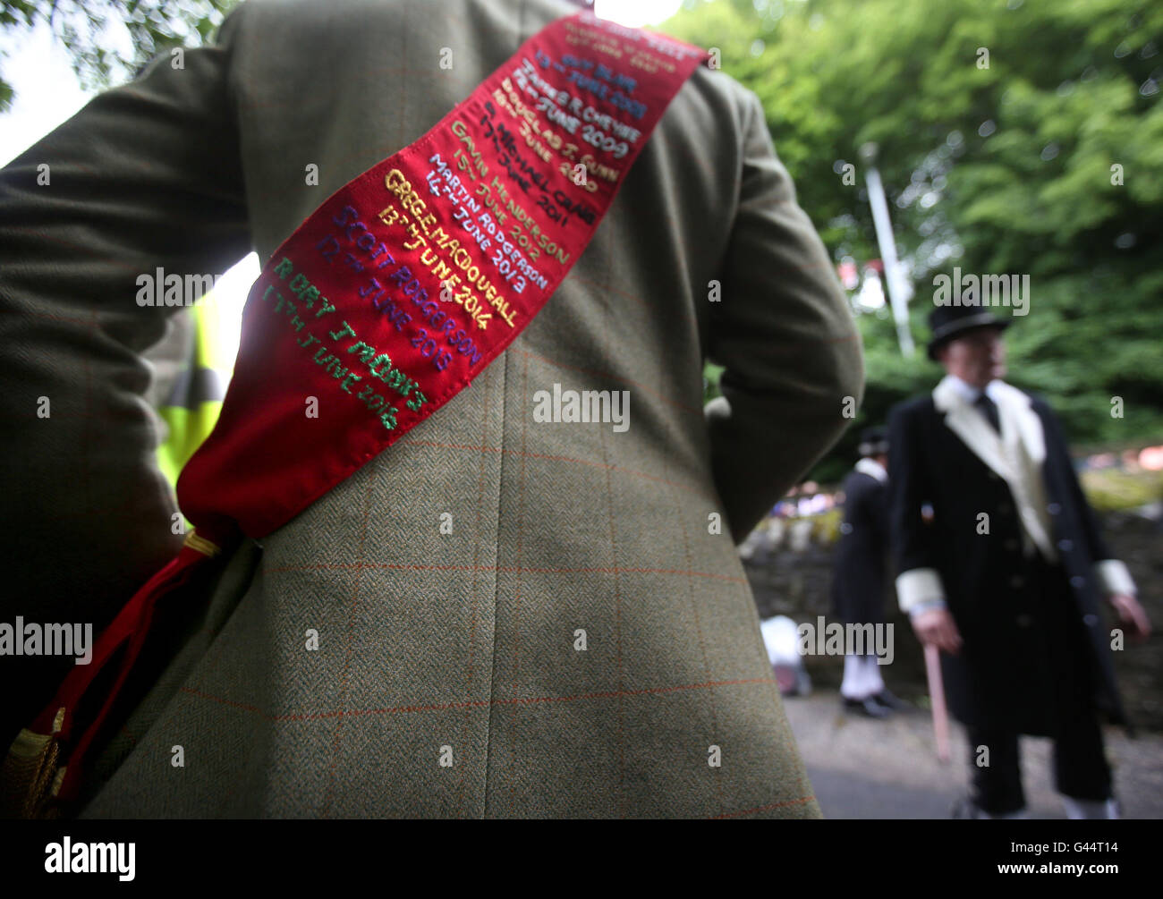 Royal Standard Bearer Rory J. Monks wears a sash bearing his name ...