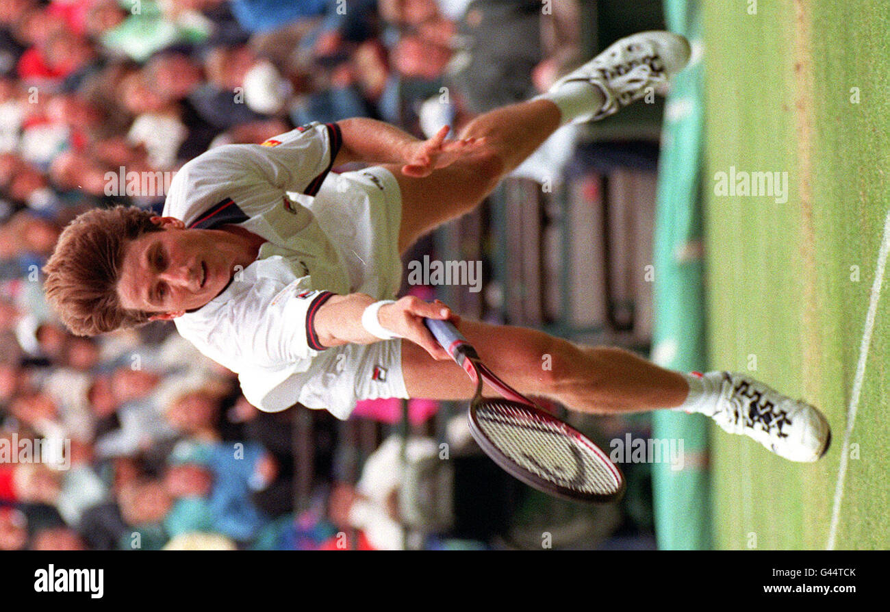 Australia's Jason Stolltenberg lunges for a ball from Goran Ivanisevic ...