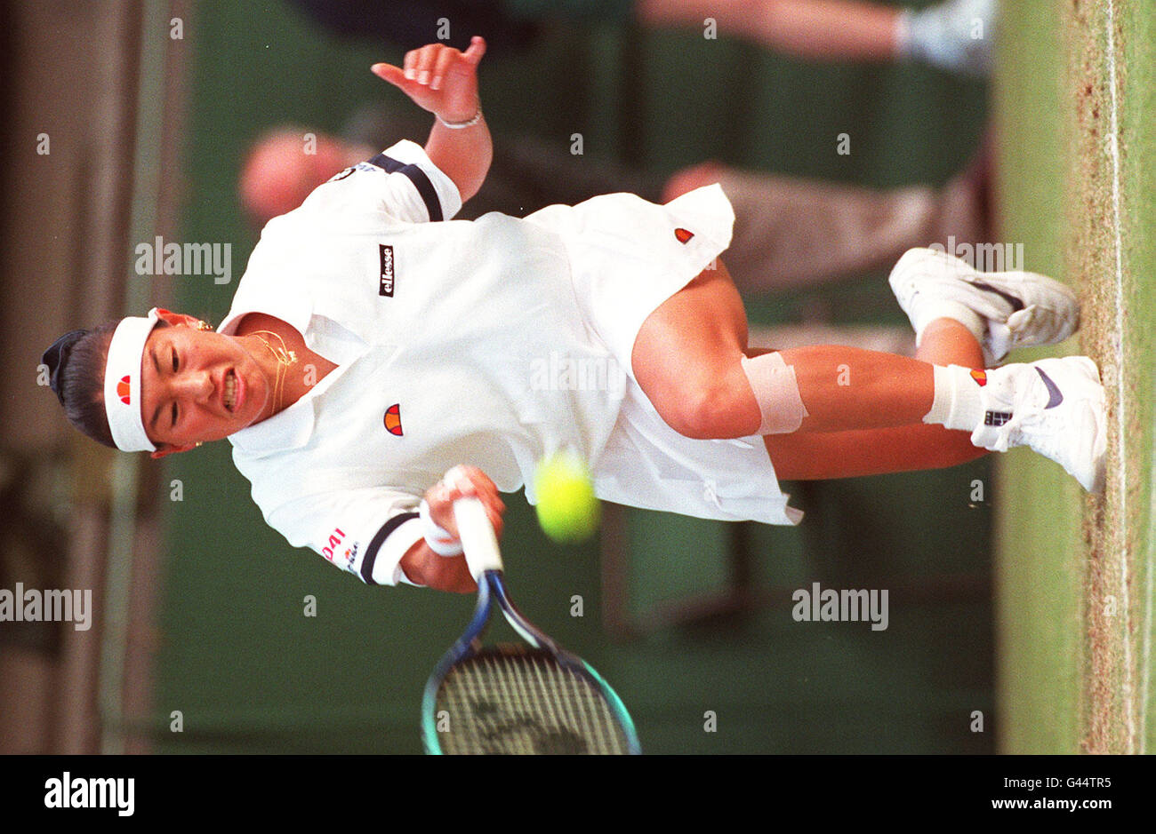 Japan's Kimiko Date chases down a ball from defending champion Steffi ...