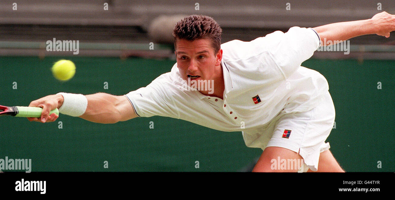 Richard Krajicek of the Netherlands at full stretch for a ball from ...