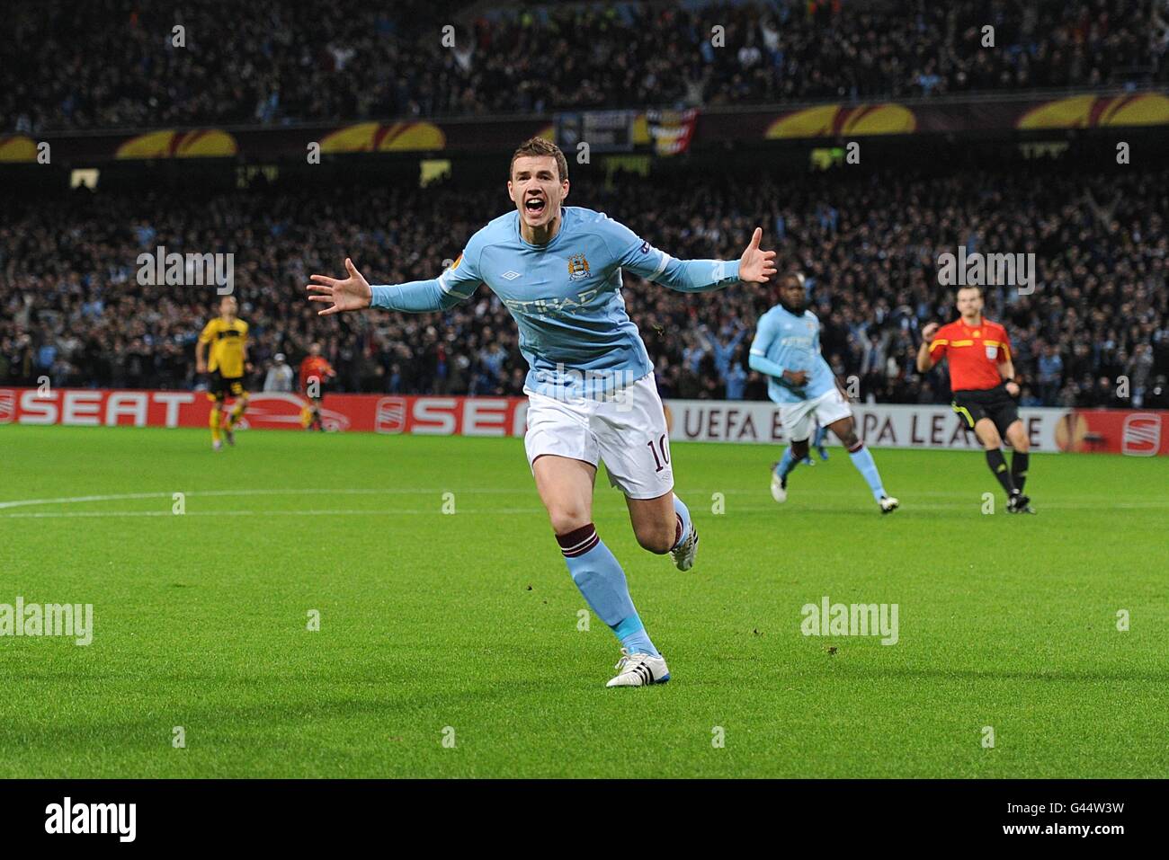 Manchester City's Edin Dzeko celebrates scoring their first goal of the ...