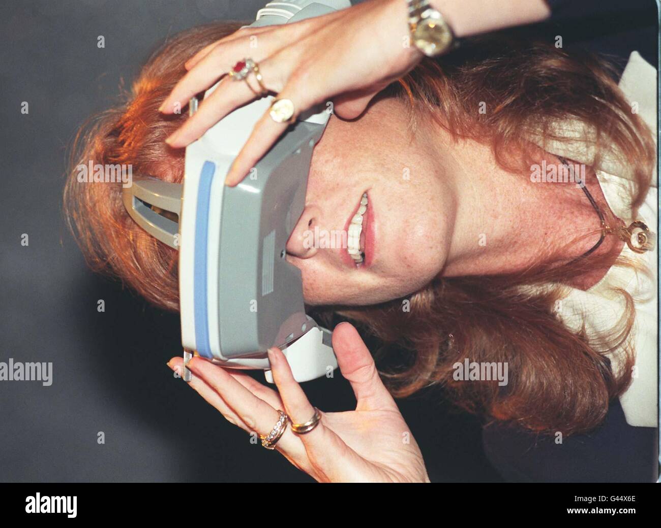 The Duchess of York tries a virtual reality game called "Space Mission ...