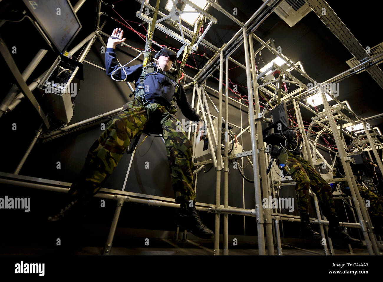 Royal Air Force personnel wear virtual reality goggles as they are ...