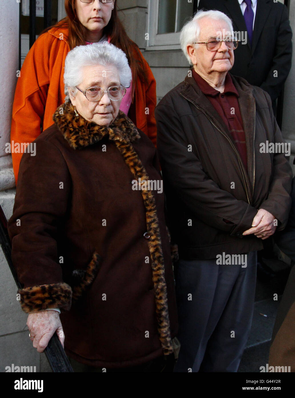 Sheila and James Patmore listen to a statement being read on their ...