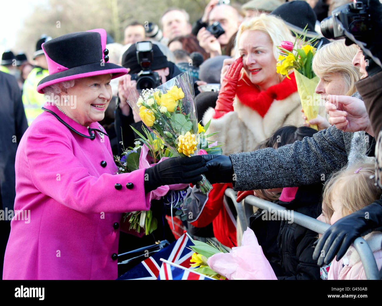 Queen Elizabeth II greets the crowds after visiting the Warwickshire ...