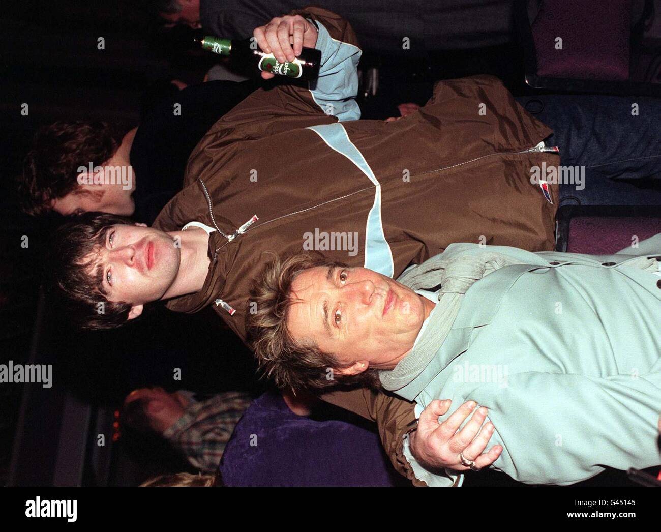 Oasis star Noel Gallagher stands alongside rock legend Rod Stewart ...