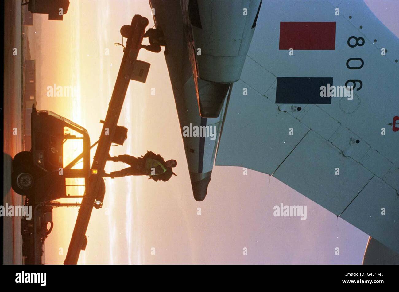 A loader assists British soldiers of the Joint Rapid Deployment Force ...