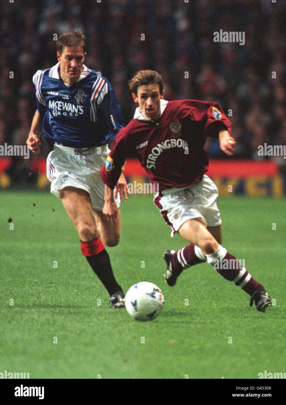 Hearts' Neil McCann (right) and Richard Gough, of Rangers, battle for ...