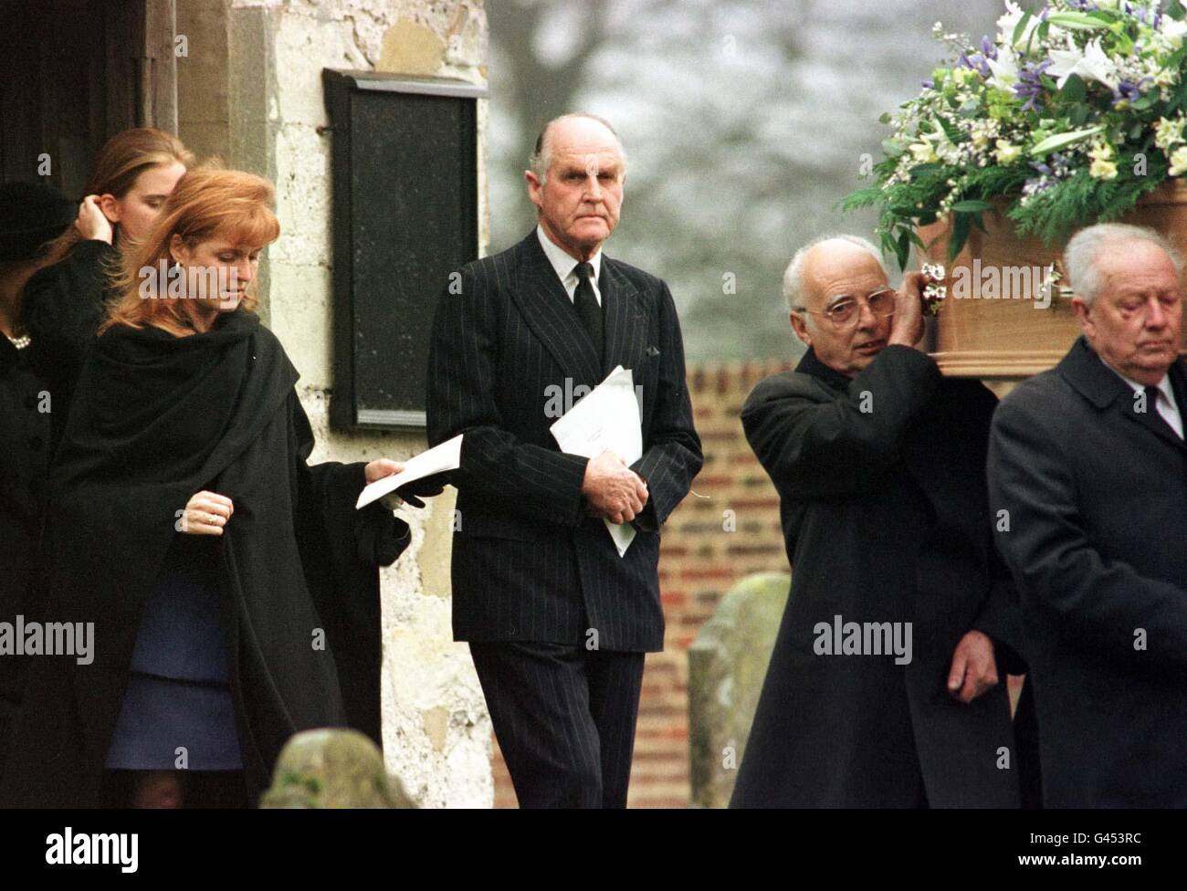 A tearful Duchess of York follows her father, Major Ronald Ferguson ...