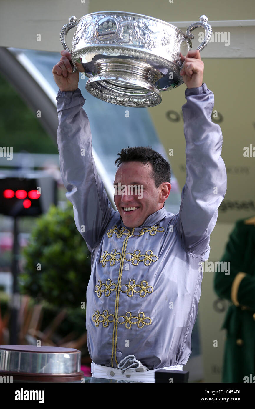 Jockey Gregory Benoist lifts the trophy for the Coronation Stake after ...