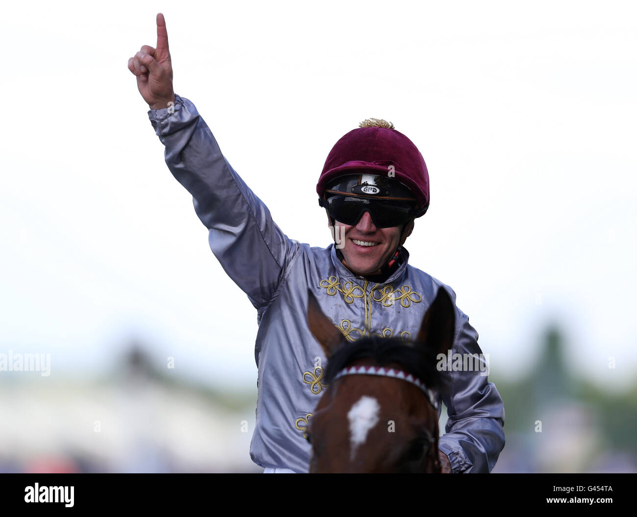 Jockey Gregory Benoist celebrates winning the Coronation Stakes during ...
