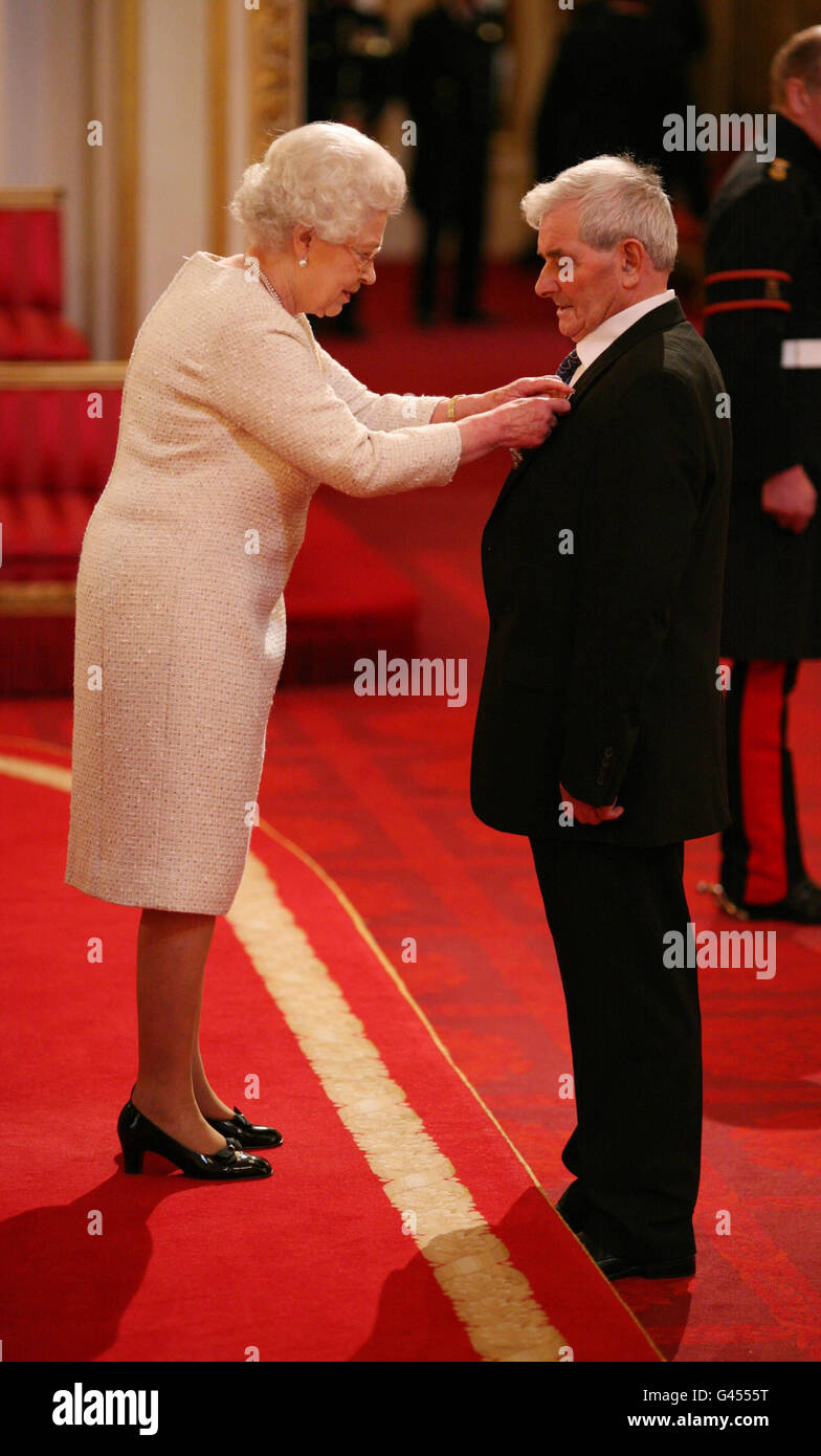 William Swinford is awarded an MBE by Britain's Queen Elizabeth II ...