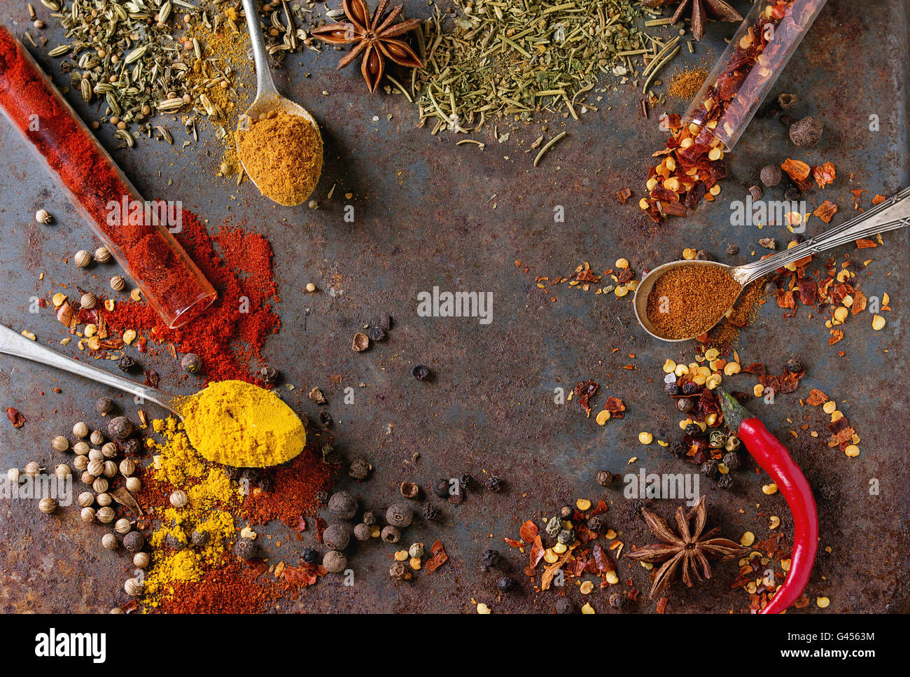 Spicy background with assortment of different hot chili and allspice ...