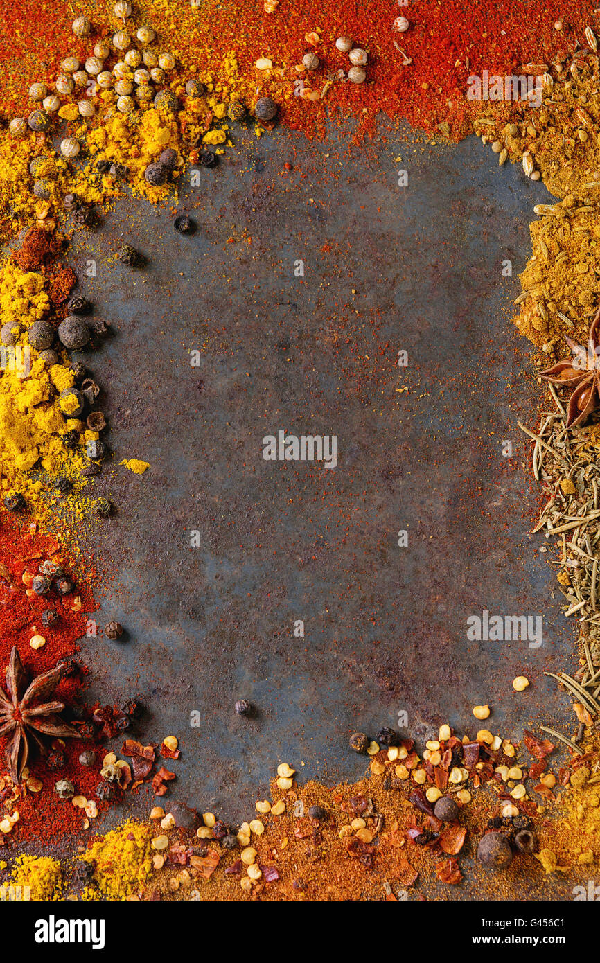 Spicy background with assortment of different hot chili and allspice ...