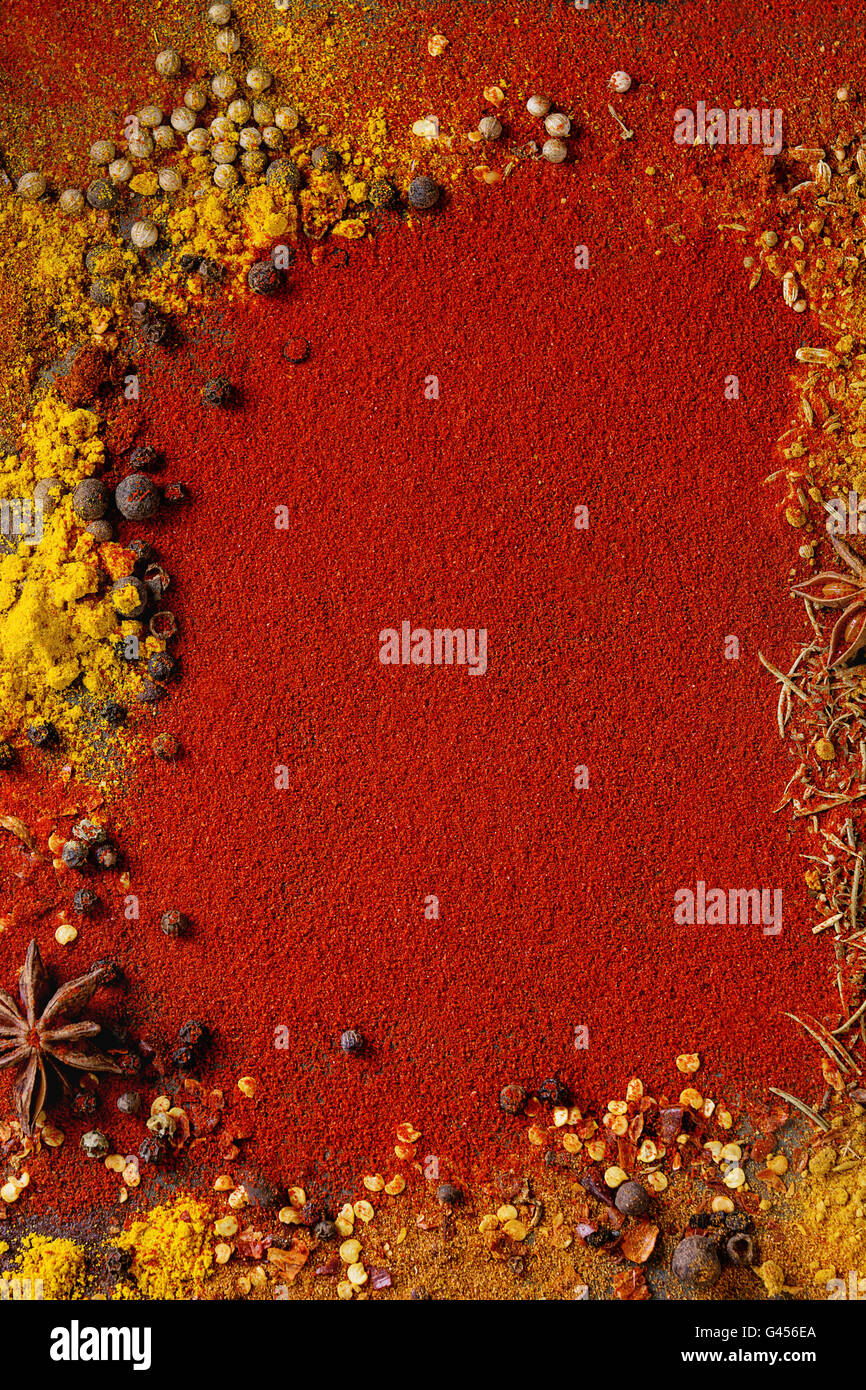 Spicy background with assortment of different hot chili and allspice ...