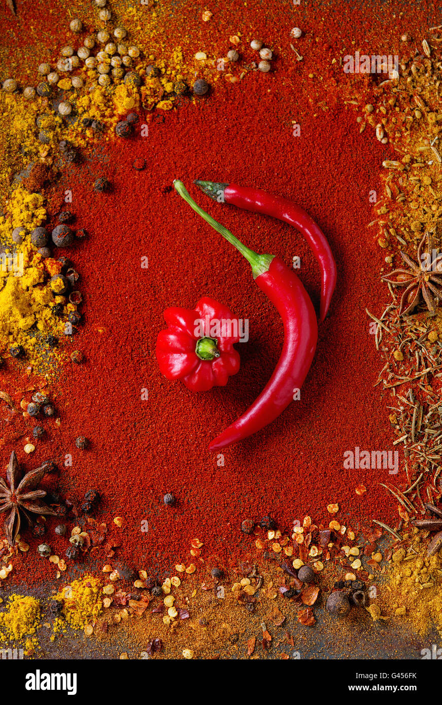 Spicy background with assortment of different hot chili peppers and mix ...