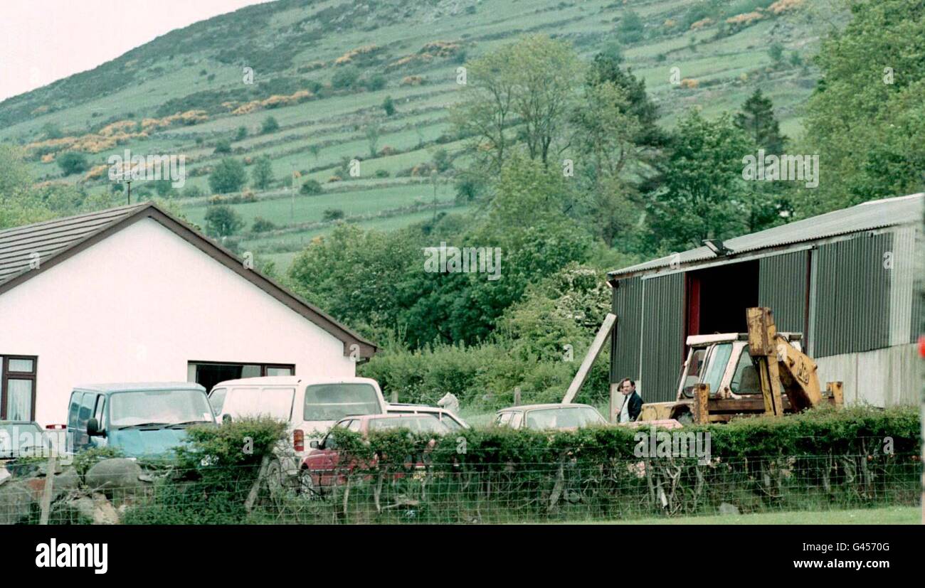 Police search a house in Forkhill, South Armagh, after four men were ...