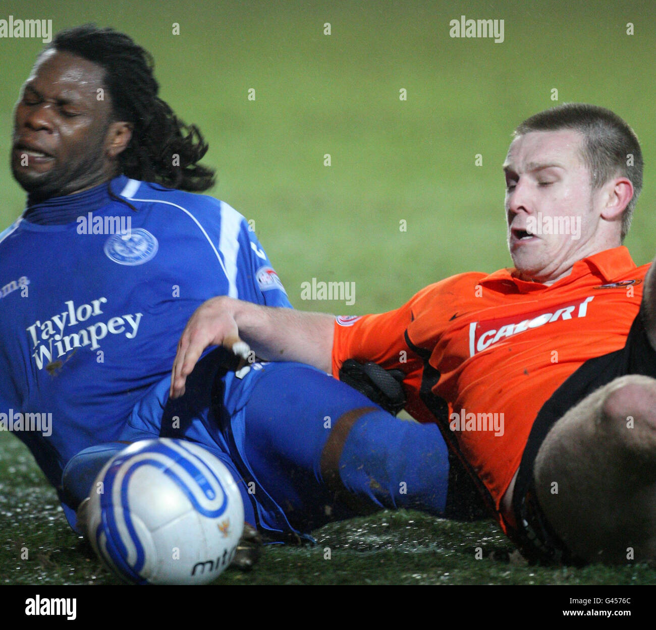 St Johnstone's Colin Samuel and Dundee United's Timothy Van Der Meulen ...