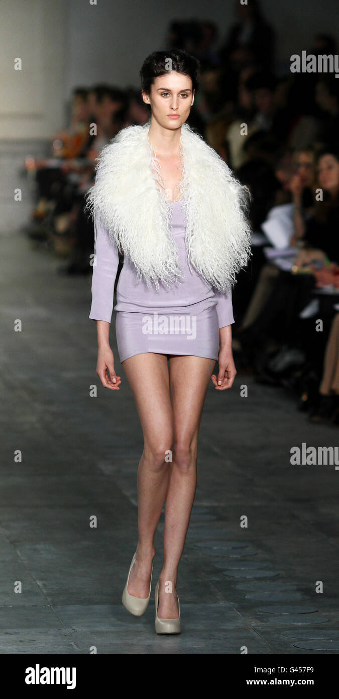 A model poses on the catwalk wearing a piece of the Elliot Atkinson ...